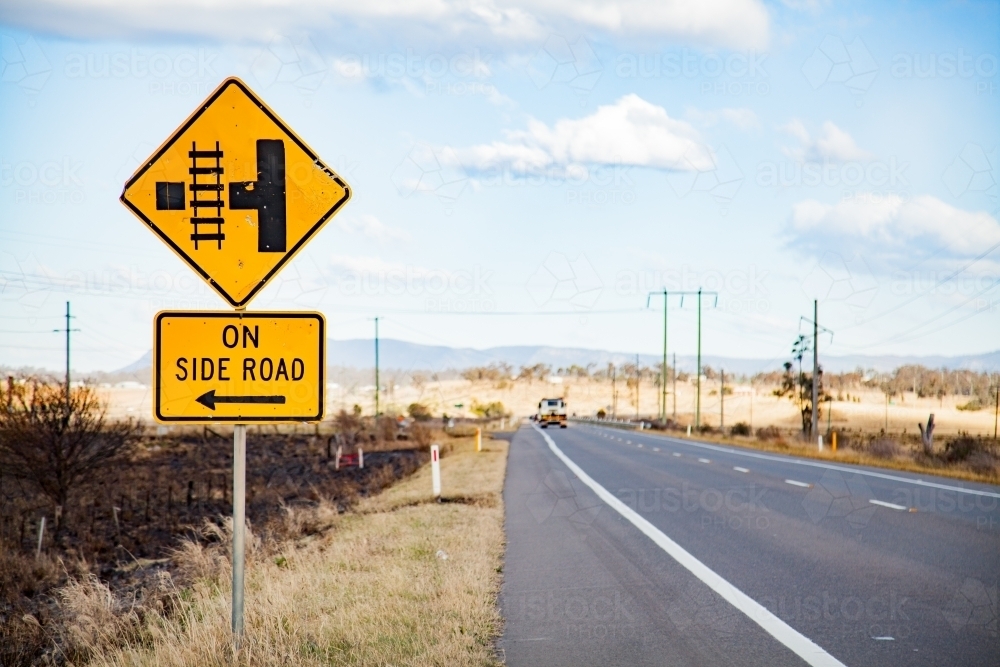 Image of Train track crossing on side road sign on rural road ...