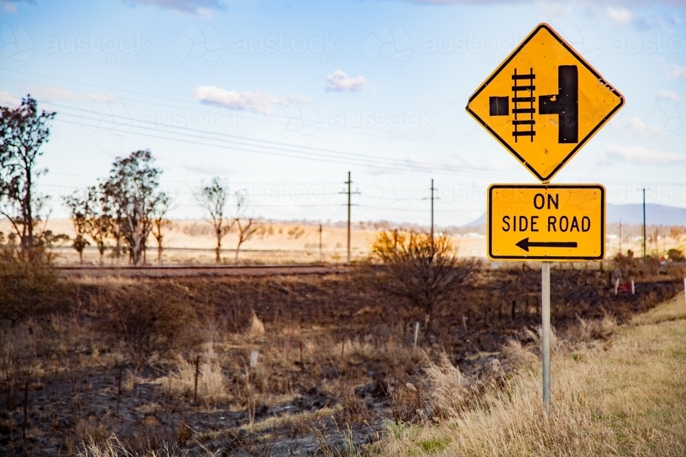 Image of Train track crossing on side road sign on rural road ...