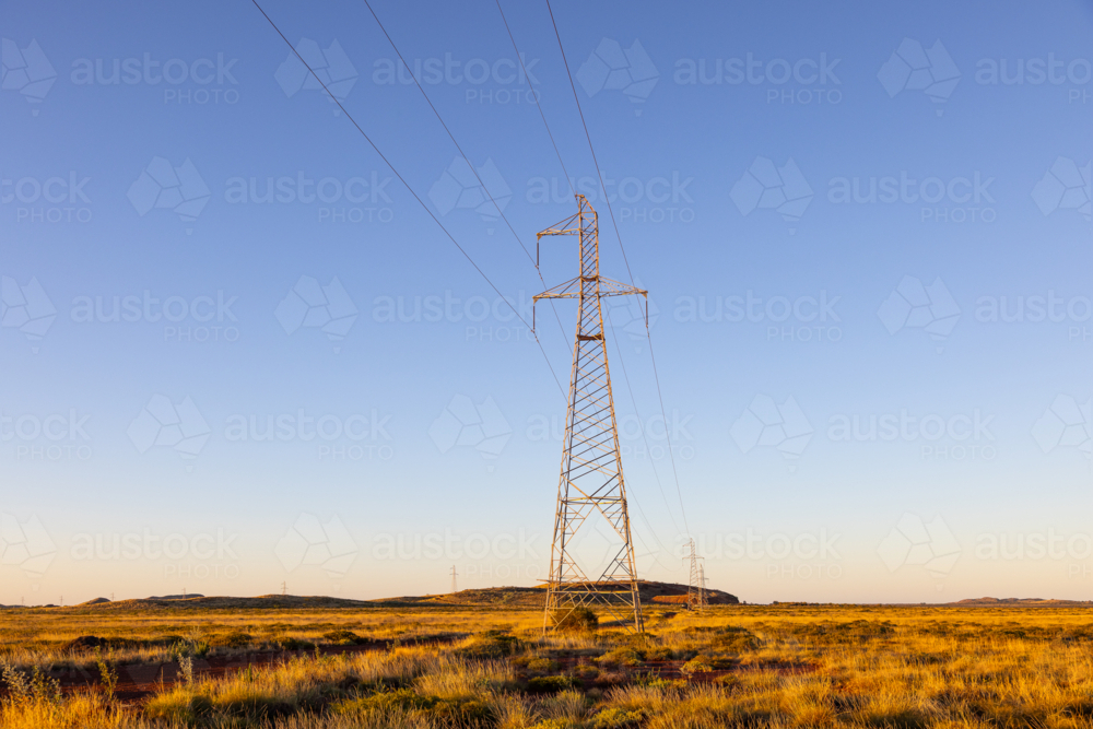 Image of transmission towers supporting power lines through the pilbara ...