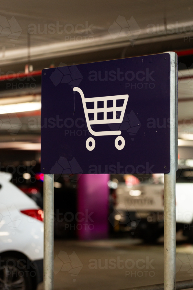 Image of trolley return sign in undercover carpark at large shopping ...