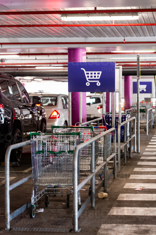 Image of trolley return sign in undercover carpark at large shopping ...