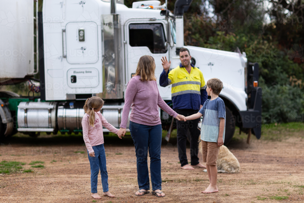Image of truck driver saying goodbye to his family before heading off ...