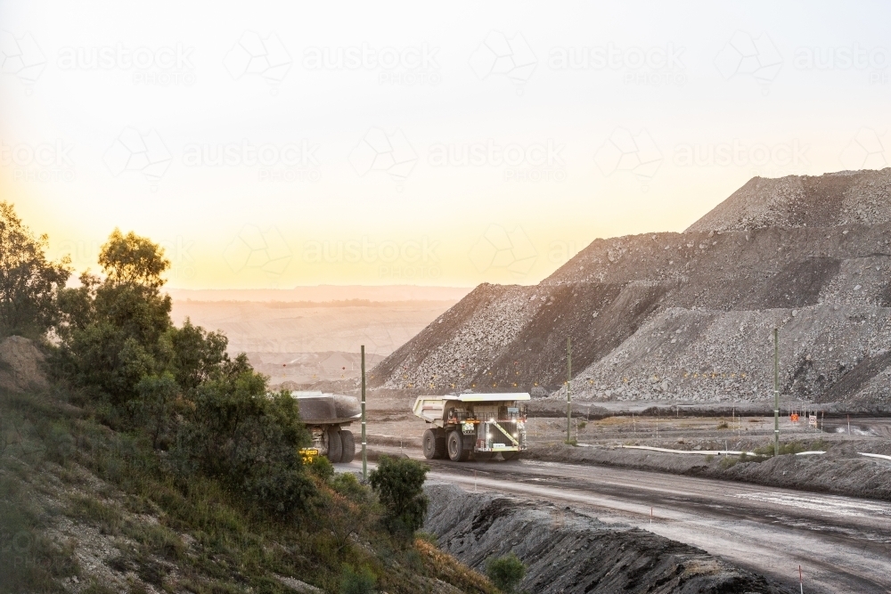 Image of Trucks working late in the day on open cut coal mining ...