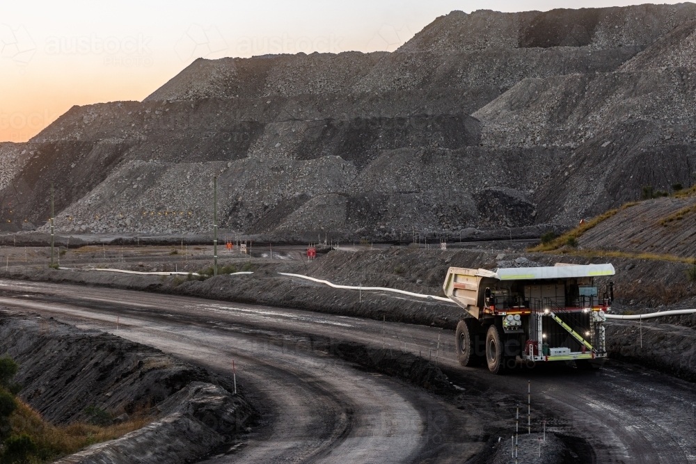 Image of Trucks working late in the day on open cut coal mining ...