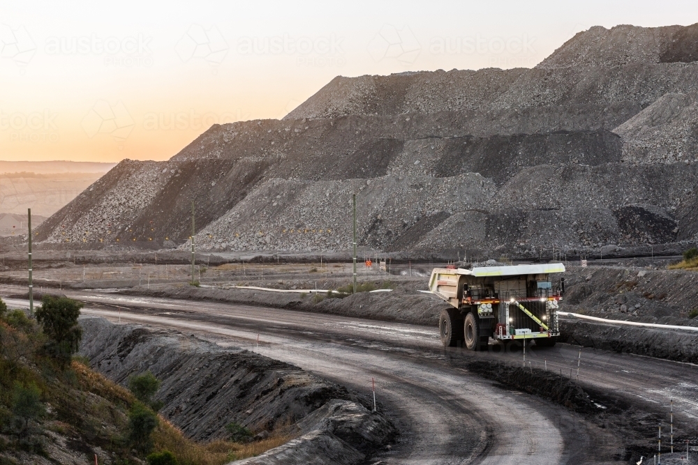 Image of Trucks working late in the day on open cut coal mining ...