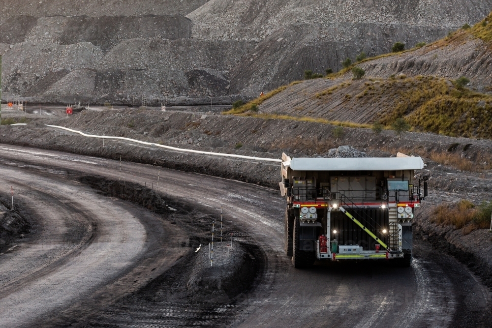 Image of Trucks working late in the day on open cut coal mining ...