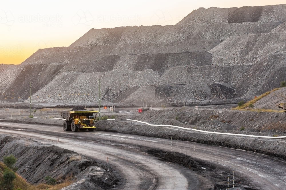 Image of Trucks working late in the day on open cut coal mining ...