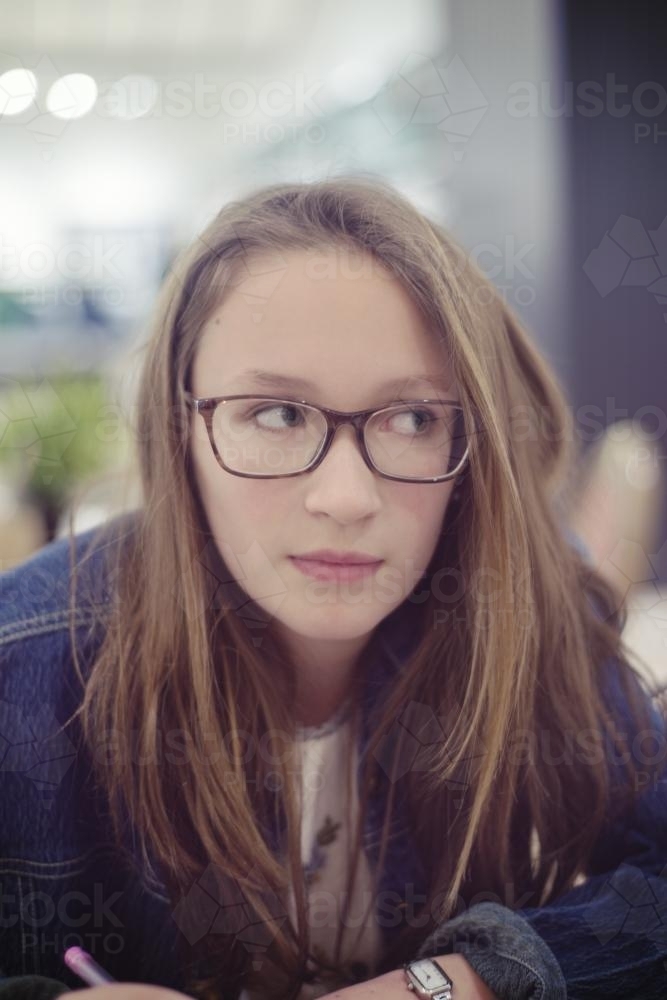 Image of tween girl thinking - Austockphoto