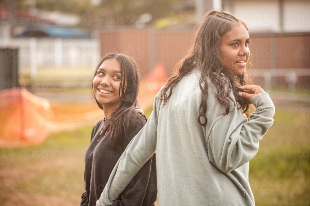 Image of Two Aboriginal girls together outside - Austockphoto