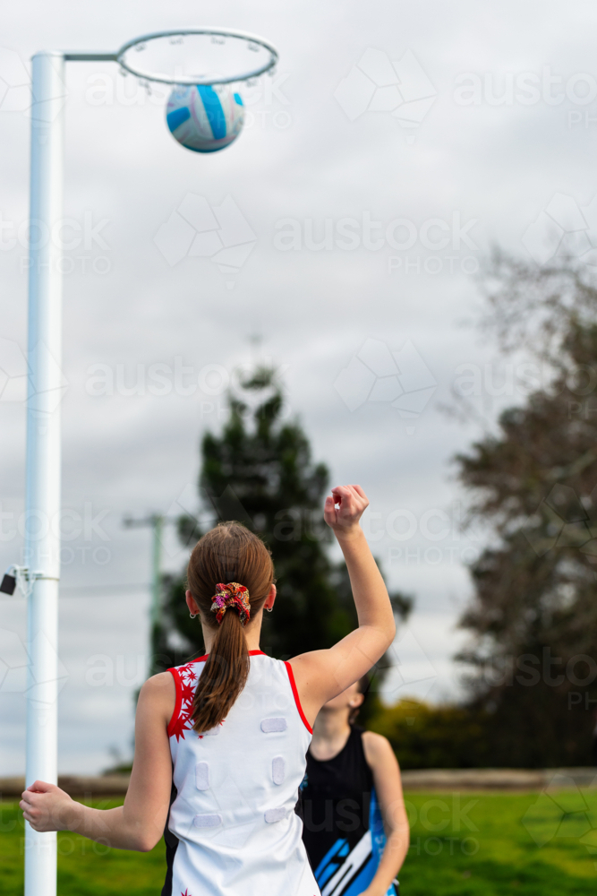 Image of Two aboriginal sisters at the court training for netball team ...