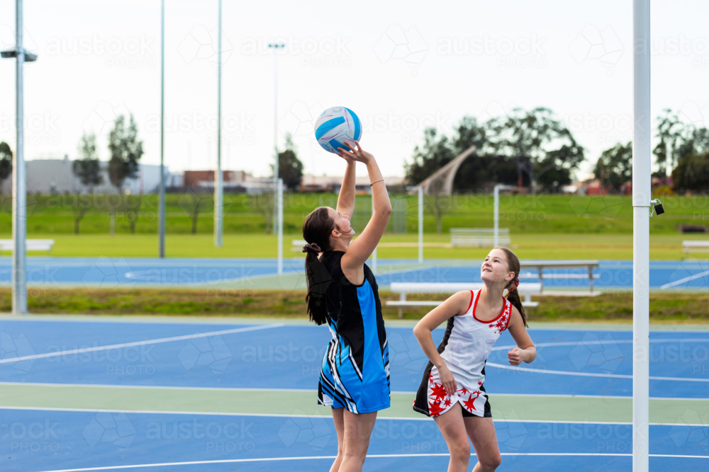 Image of Two Aboriginal sports players training for netball game at the ...
