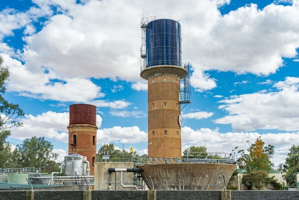 Image of Two concrete water towers with tanks on top at a treatment ...