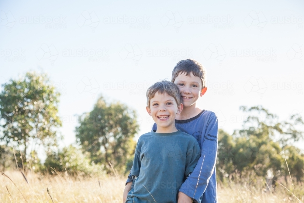 Image of Two happy Aussie kids looking at camera with copy space ...