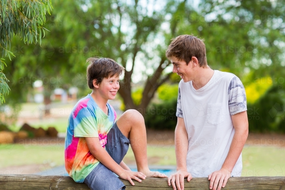 Image of Two happy boys in a park - Austockphoto