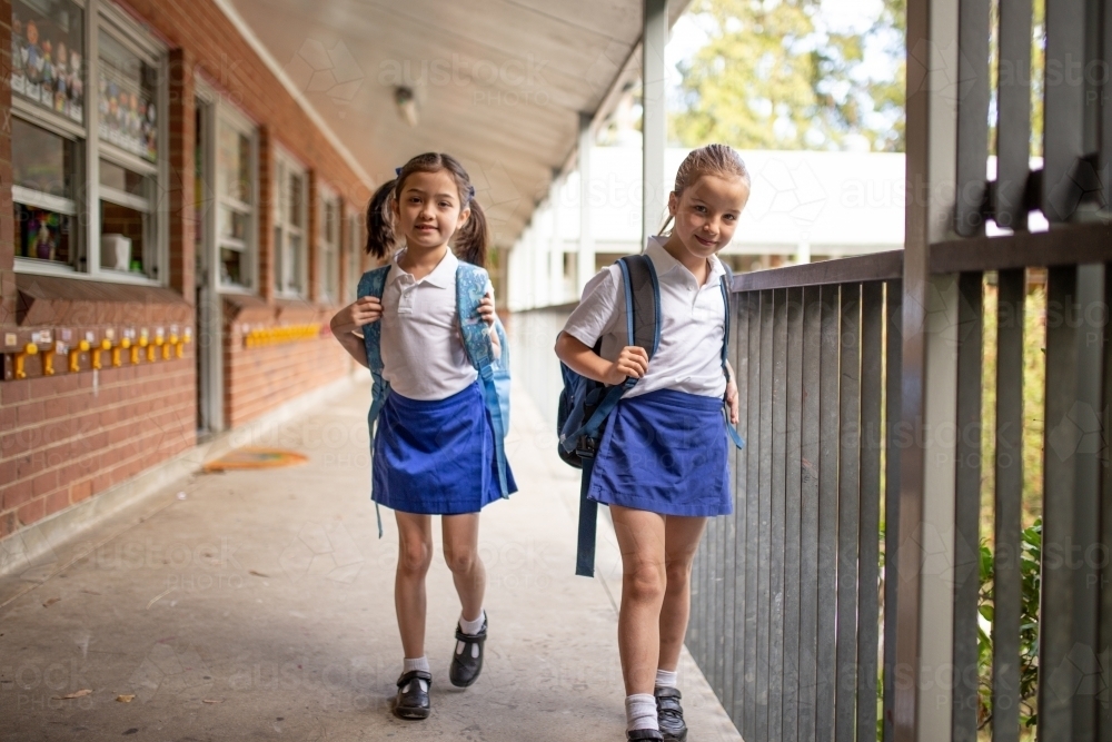 Image of Two Students Walking on Balcony - Austockphoto