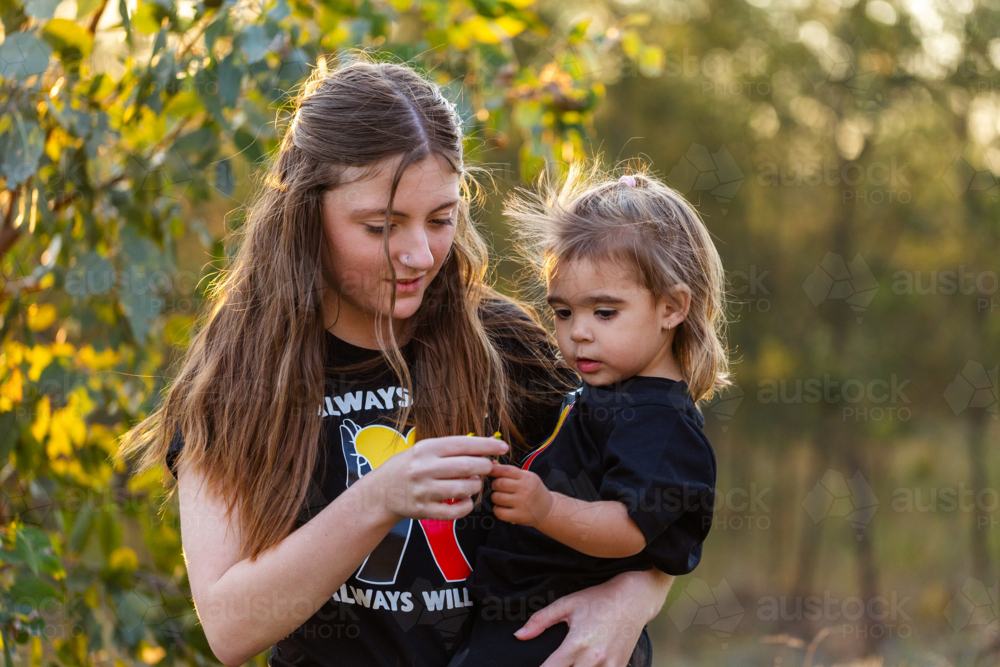 Image of Two year old Australian toddler playing outside in nature with ...