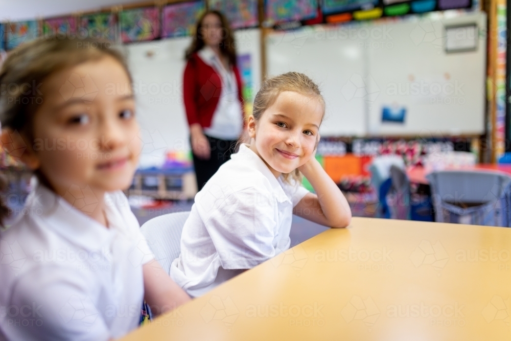 Image of Two Young Schoolgirls Smiling at Camera in Classroom ...
