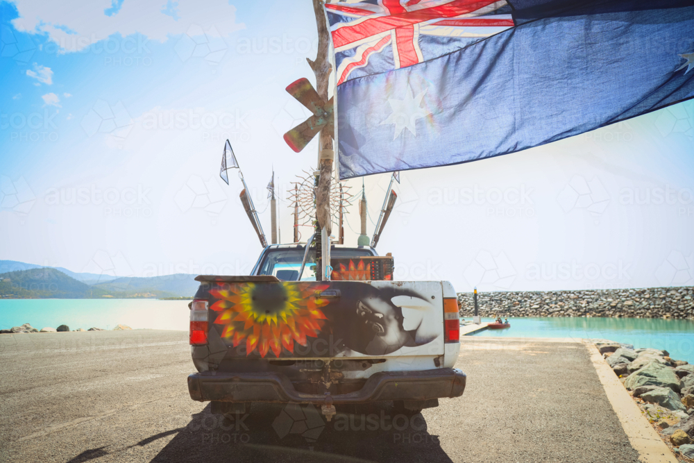 Image of Unusually decorated ute flying Australian flag parked at boat ...