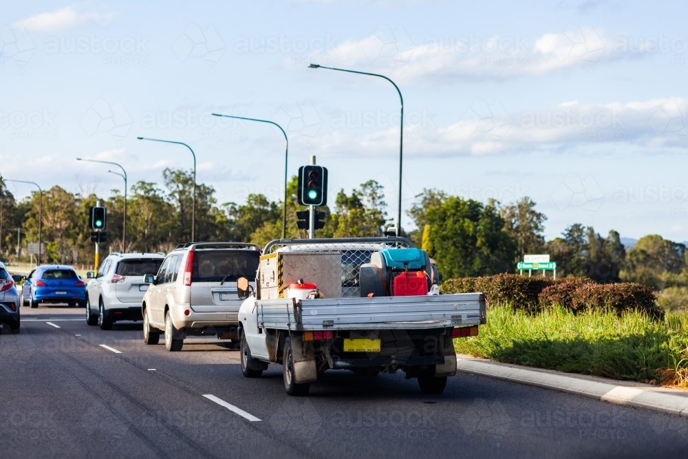 Image of Ute and traffic on road at green traffic light signal ...