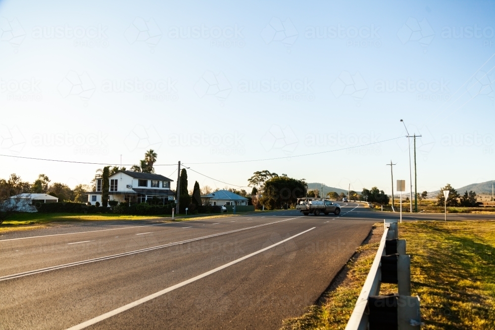 Image of Ute turning across traffic on road right hand turn - Austockphoto