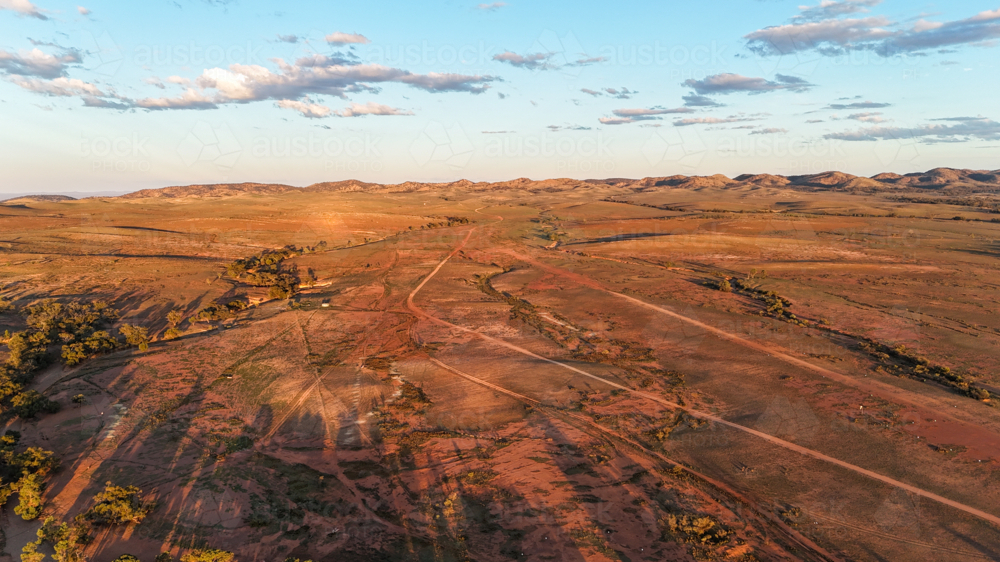 Image of Vast outback ranges at golden hour - Austockphoto