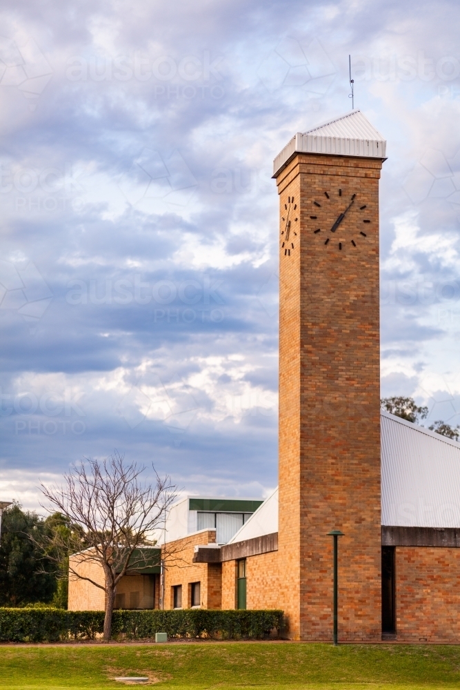 Image of Vertical image of brick clock tower in last light of day in ...