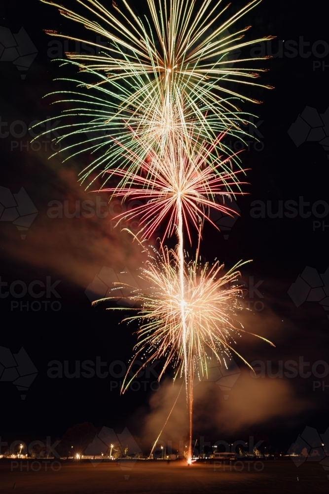 Image of Vertical image of fireworks display at local community event ...