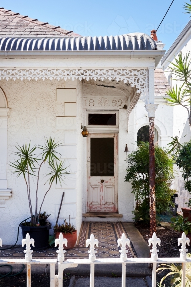 Image of Vertical shot of a small white side door - Austockphoto