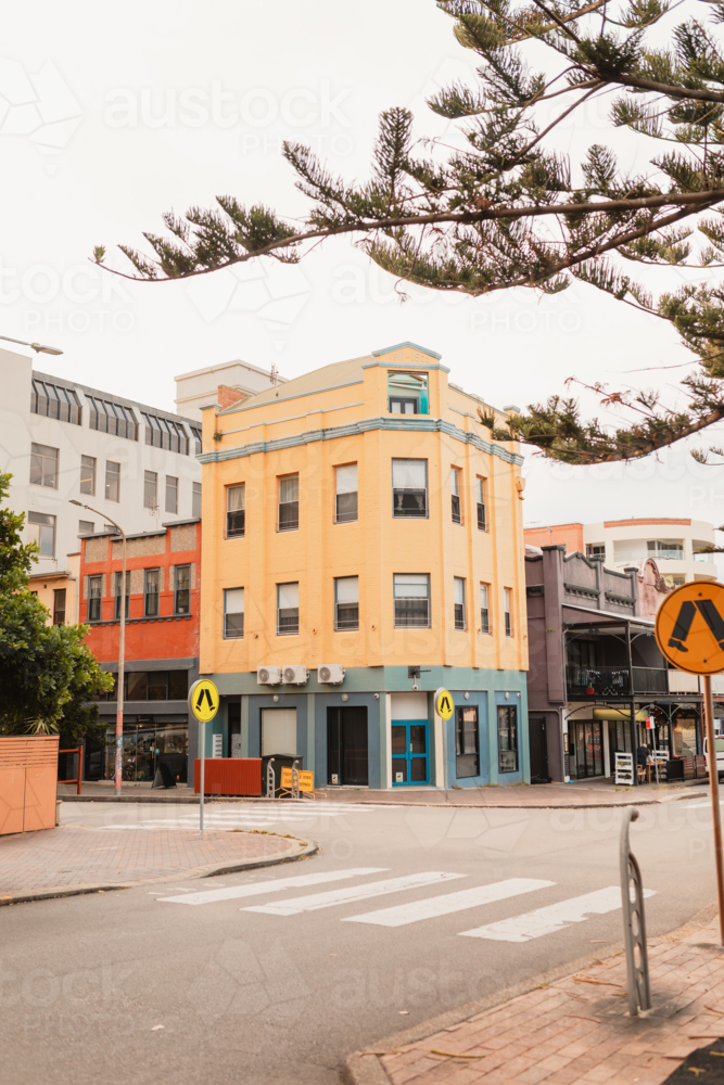 Image of Vibrant yellow and blue building on street corner in Newcastle ...