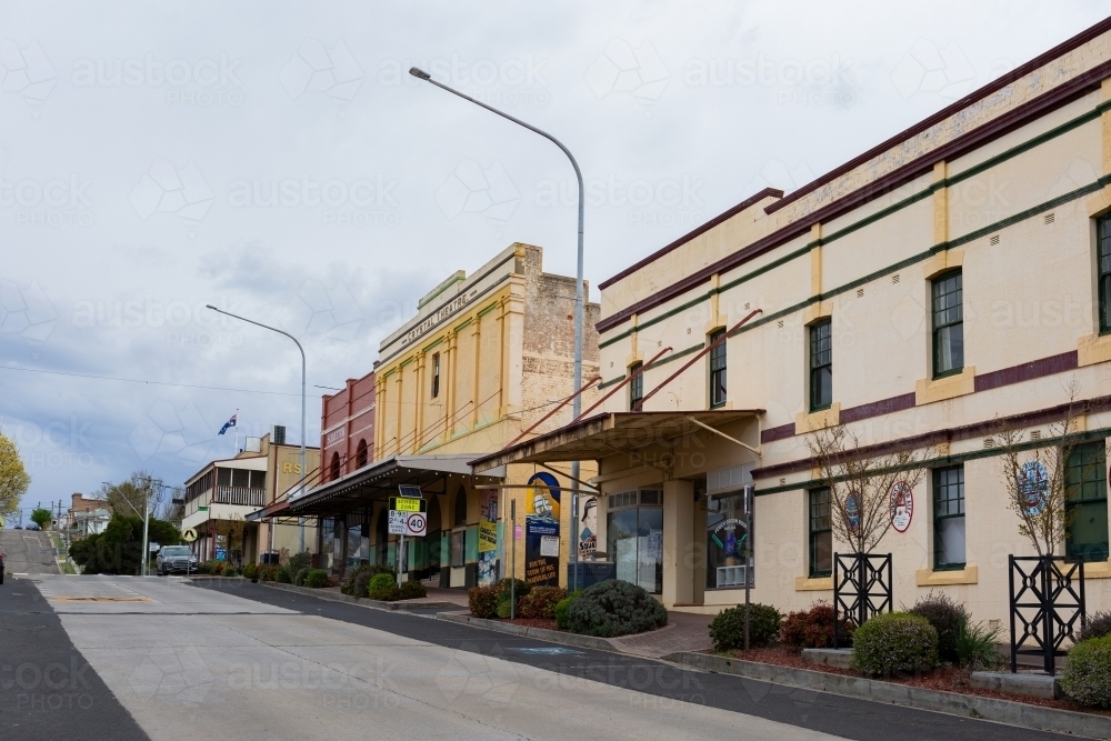 Image of View down historic old shopfronts along street in country town ...
