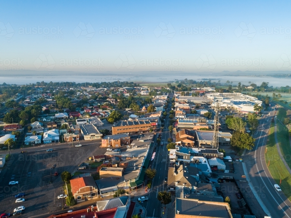 Image of View down main street road and shops of country town in ...