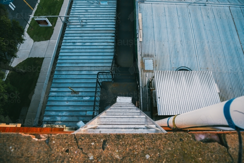Image of View from roof of ladder leading down to lower level ...