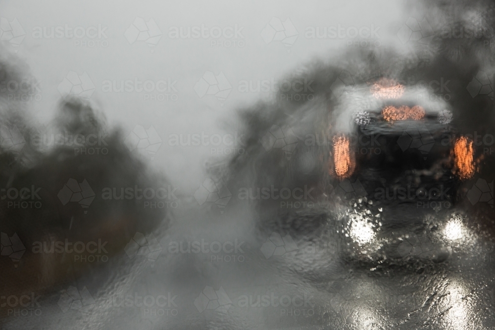 Image of view through a rainy windscreen at an oncoming truck ...
