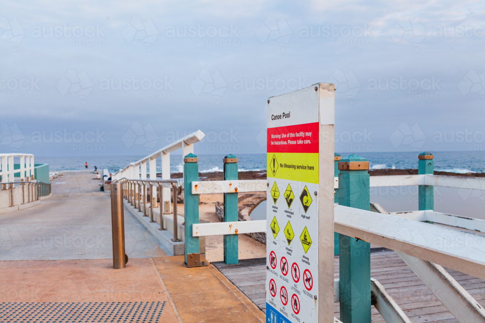 Image of Warning sign by Canoe Pool steps at Newcastle beach on ...