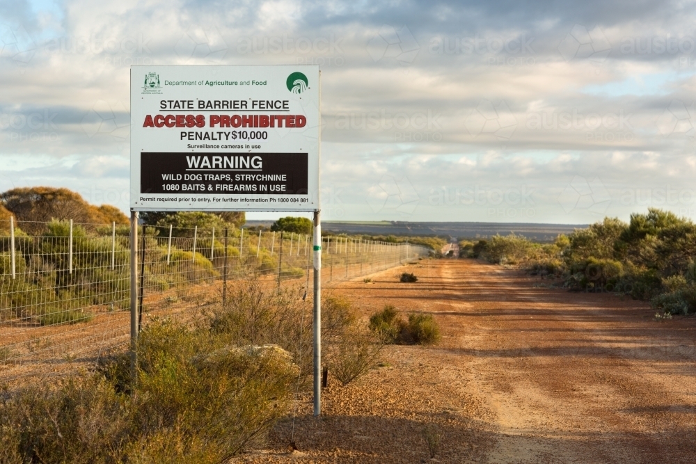 Image of Warning Sign on the state barrier fence - Austockphoto