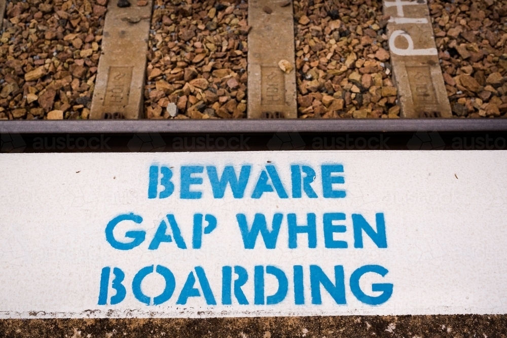 Image of Warning sign to beware the gap at Harden railway station ...