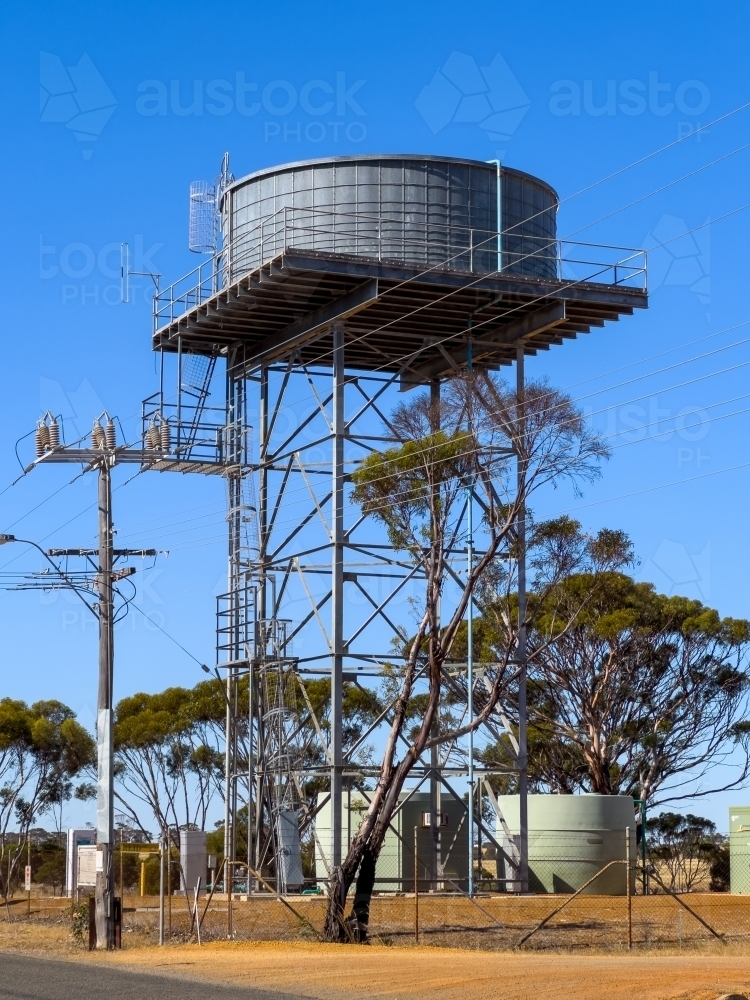 Image of water supply with elevated tank on stand and pumping equipment ...