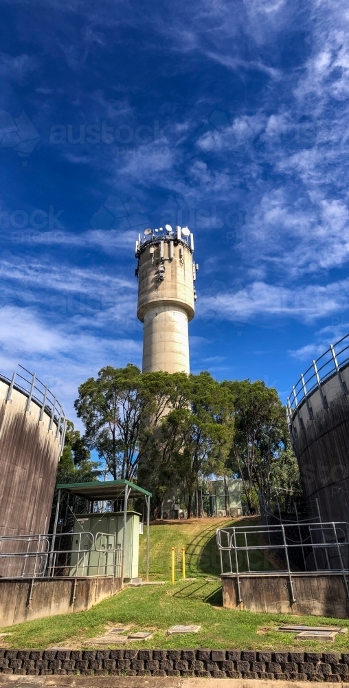 Image of Water tower and two large concrete water tanks. - Austockphoto