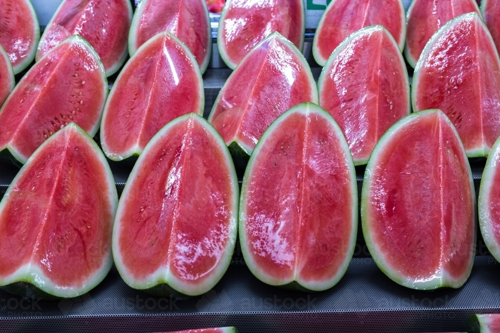 Image of watermelon for sale at a green grocer - Austockphoto