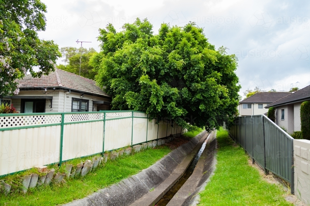 Image of Waterway through city housing area for stormwater drainage ...