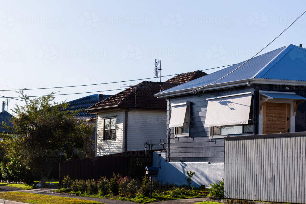 Image of weatherboard houses with awnings over windows and electricity ...
