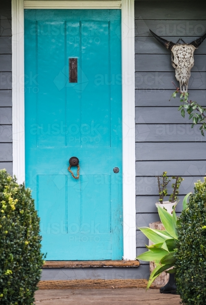 Image of Welcoming blue front door and entrance - Austockphoto