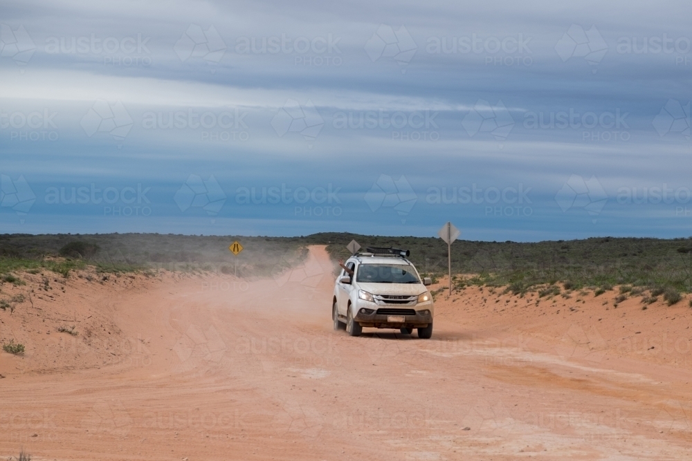 Image of White 4wd driving remote dirt roads - Austockphoto