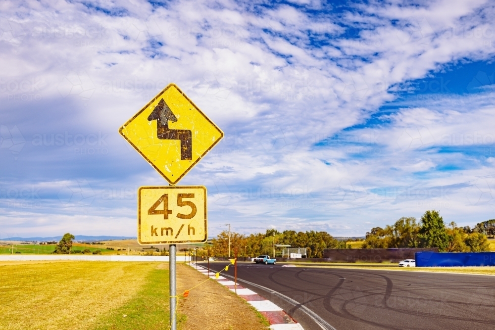 Image of Winding road warning sign on the Mount Panorama racing circuit ...