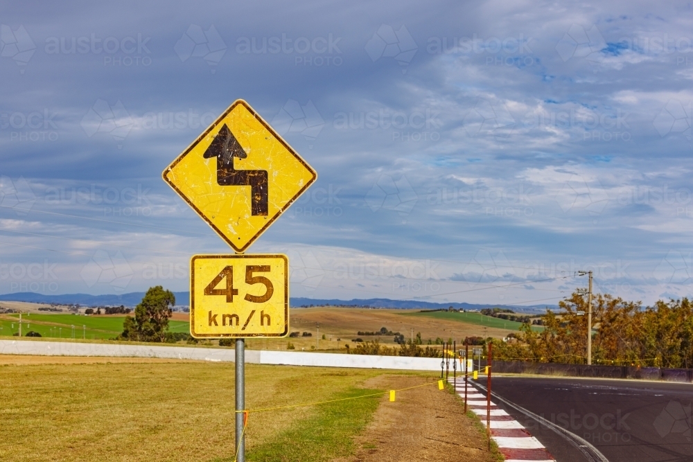 Image of Winding road warning sign on the Mount Panorama racing circuit ...