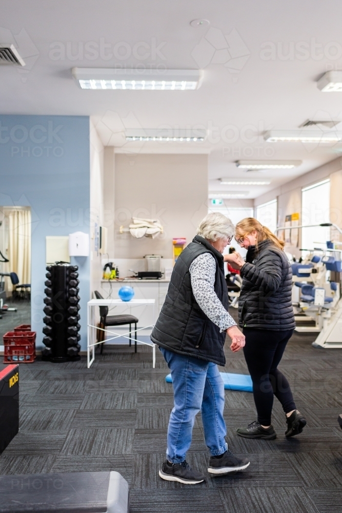 Image of Woman doing balance practice with physio at physiotherapist ...