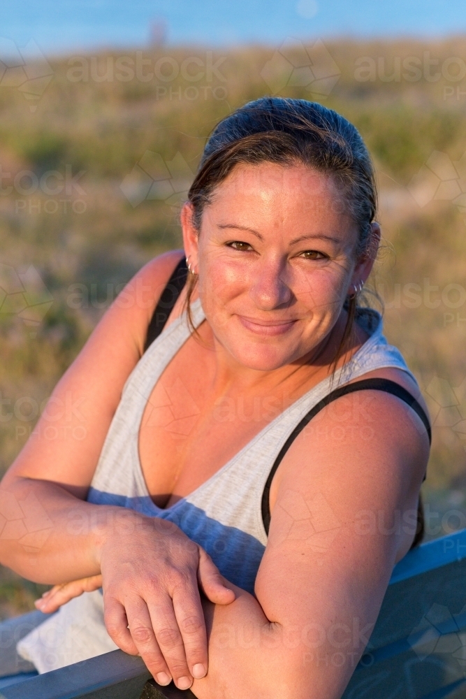 Image of Woman outside in sunshine - Austockphoto