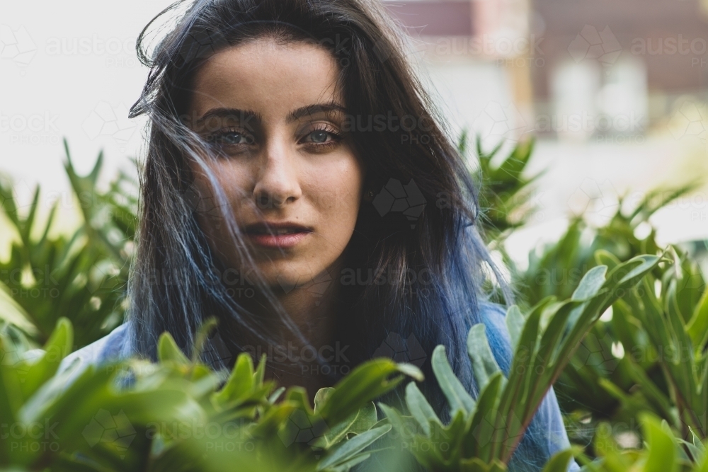 Image of woman's face in plants - Austockphoto