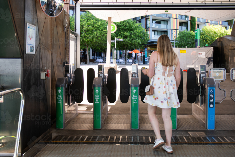 Image of woman tapping off at ferry terminal in Sydney - Austockphoto
