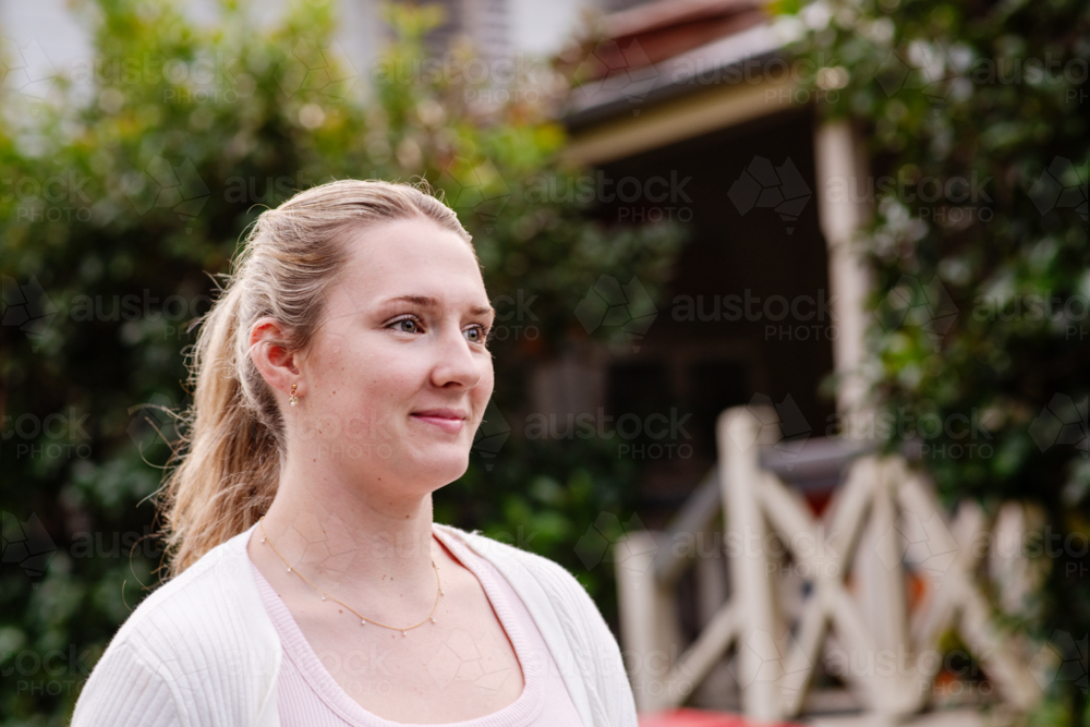 Image of Woman Walking on Suburban Street - Austockphoto
